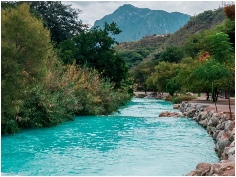 Relax in a Hot Spring Infinity Pool Overlooking Volcanic Mountains ...